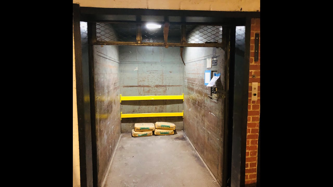 Run-down 60s Otis traction freight Elevator at an under construction ...