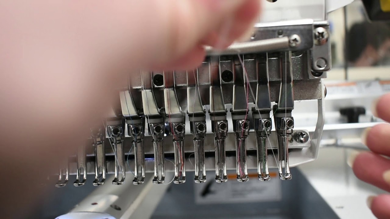 How to Put Loose Threads on the Spring on the Barudan - YouTube