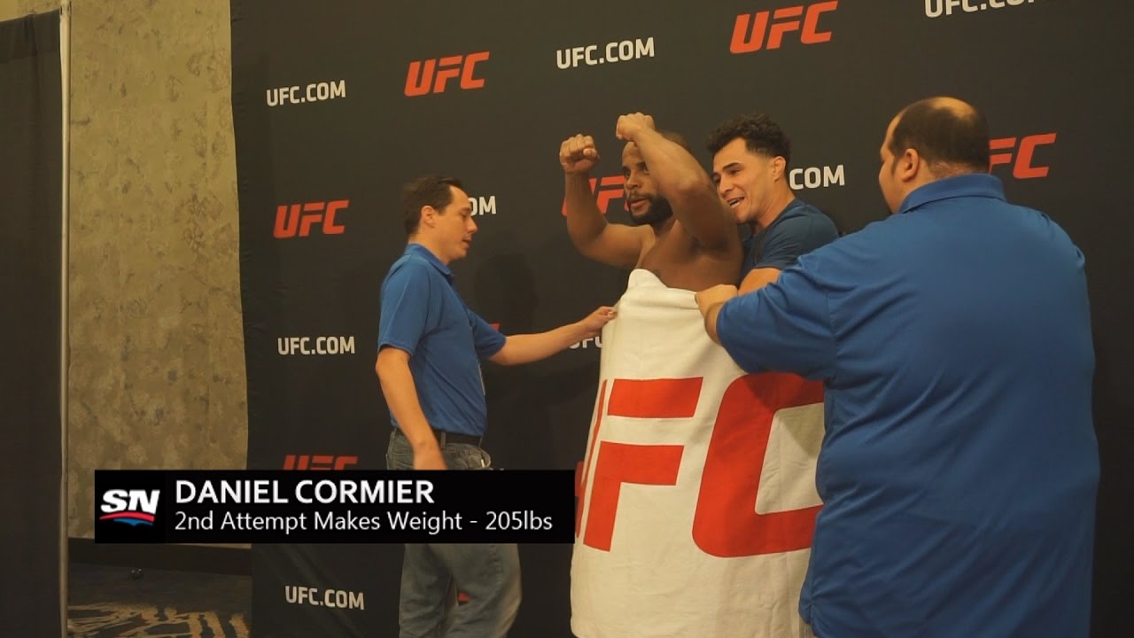 UFC 210's Daniel Cormier makes weight at 205lbs on 2nd attempt - YouTube