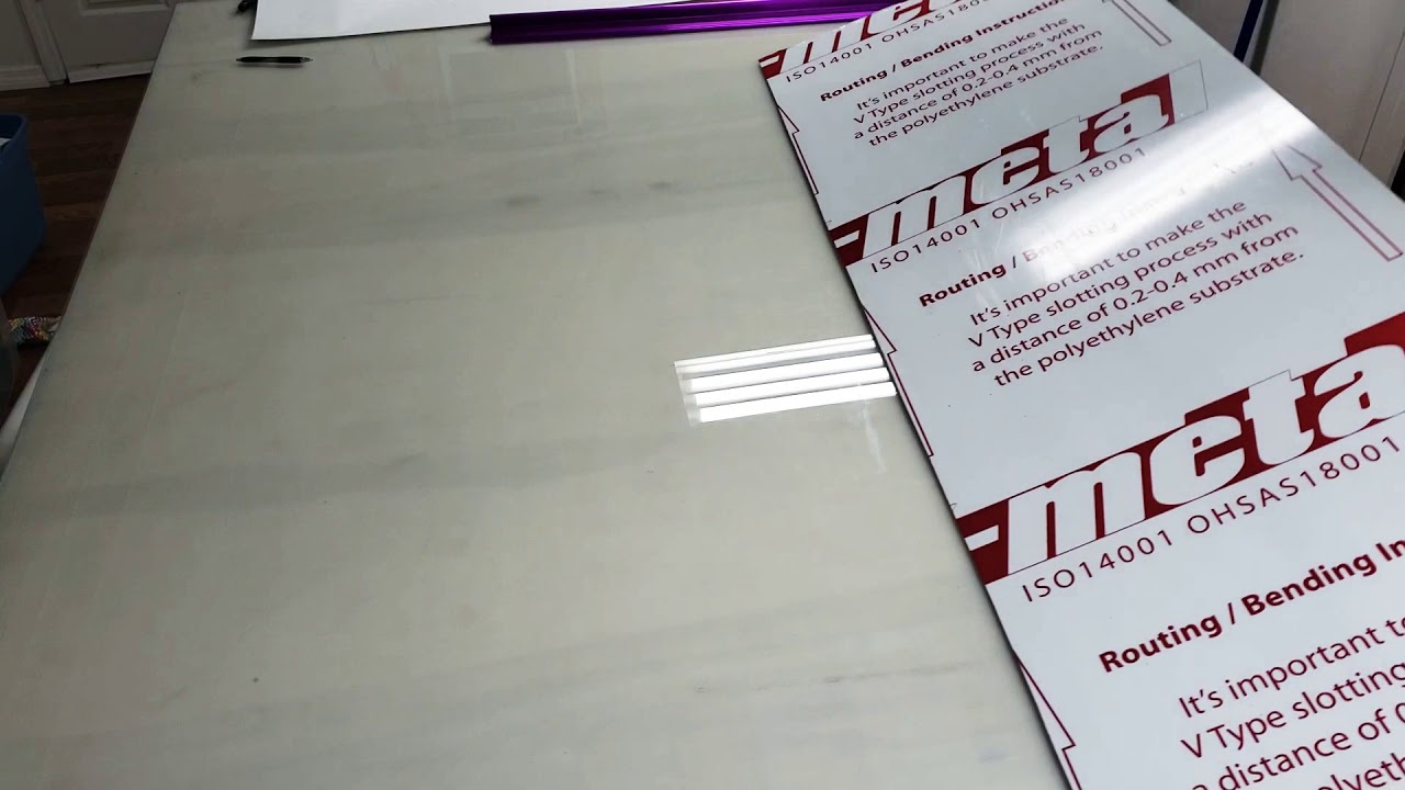 Applying printed vinyl to a sign board - YouTube