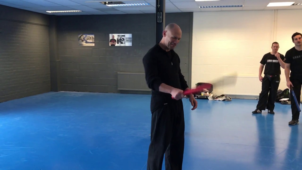 Defending a one hand overhead stick attack with a solid piece of wood ...