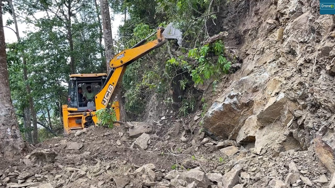 Knocking Down Rock Cutting Out Rocky Hillside with JCB Backhoe Loader ...