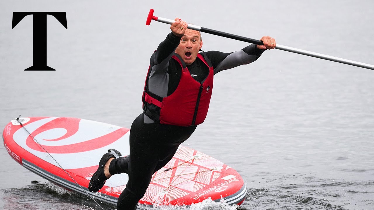 Sir Ed Davey falls off a paddleboard on Lake Windermere - YouTube
