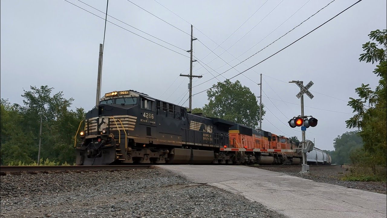 NS C6M #4266 (P5 horn), WFRX MAC #8964, & BNSF D9 #5117 lead a WB ...