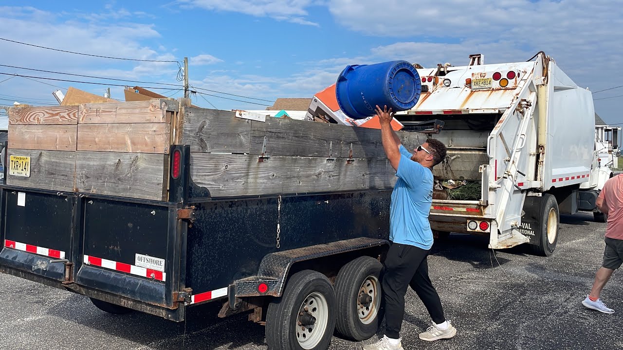 International Loadmaster Rear Loader Garbage Truck Pulling a Recycle ...