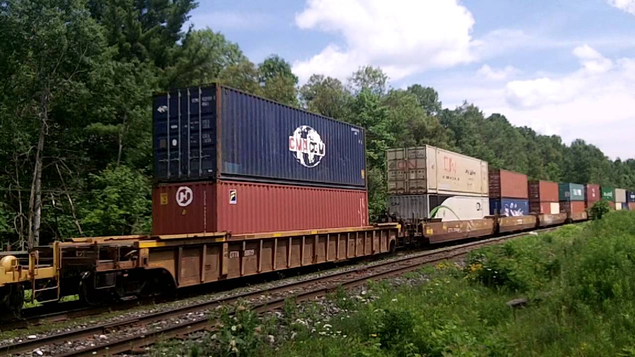 CN 105 w/ CN Engines 5614 & 2404 lead this long NB Intermodal train thru Severn Bridge, Ontario ...