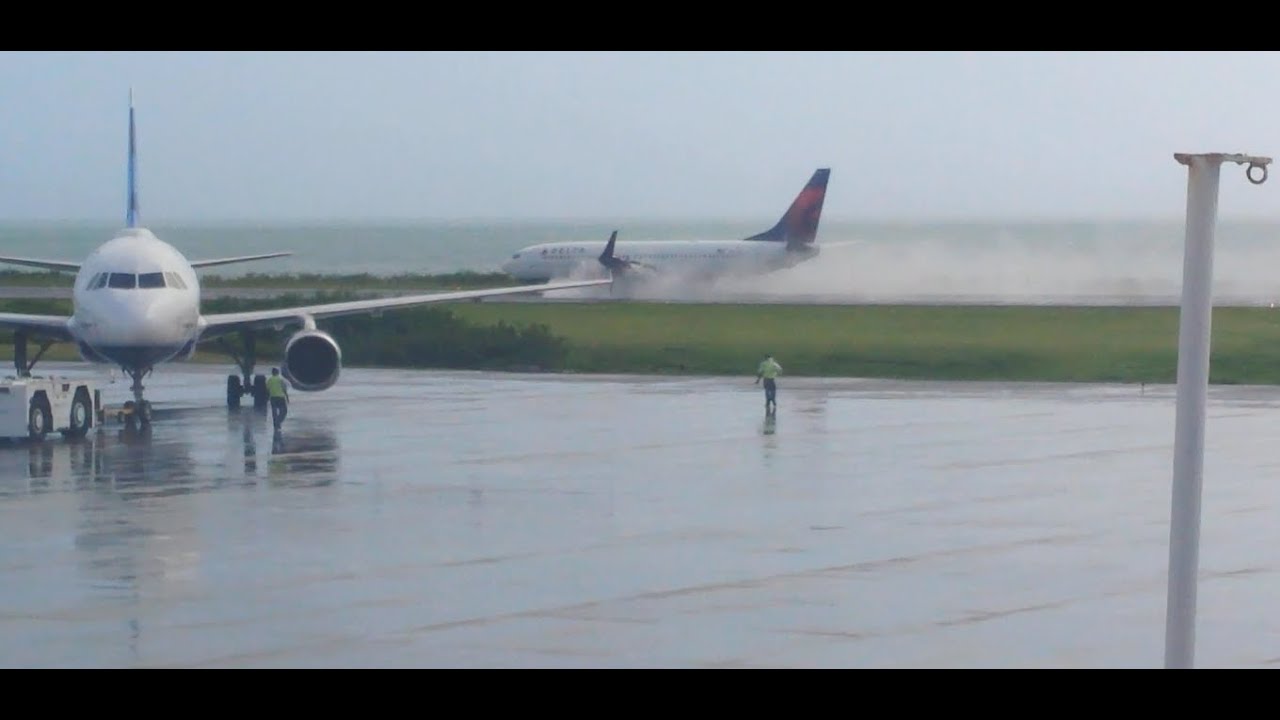 Delta 737 and Jetblue A320 Wet Runway action at Maurice Bishop Int'l ...