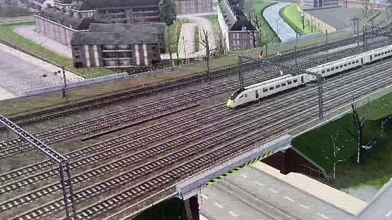 TS2020 Class 801 bullet train in the UK passes a Class 365 Commuter ...