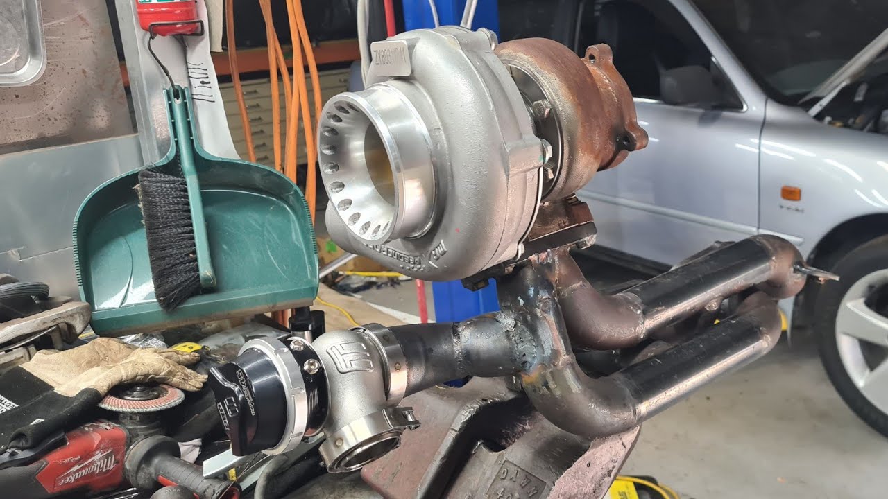 Adding a wastegate to the custom k24 turbo manifold! - YouTube