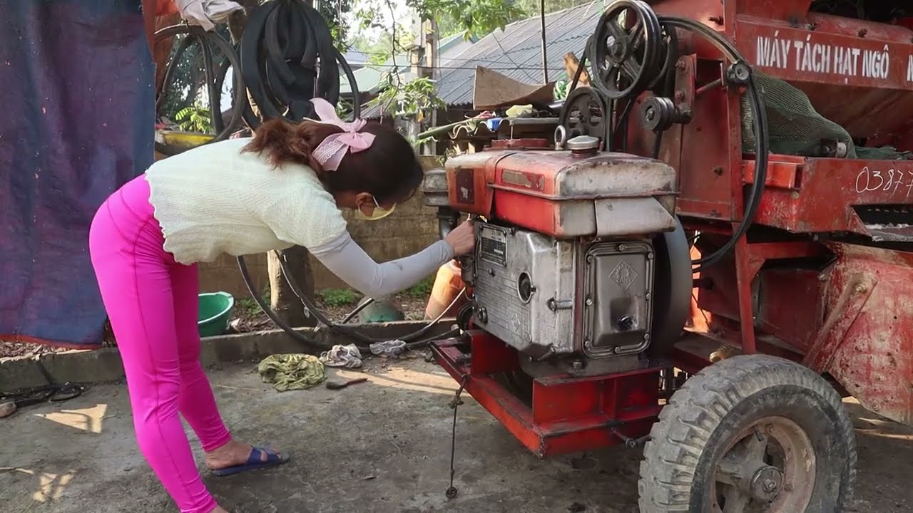 Genius girl repairs, restores and Assembling a corn grinder for a ...