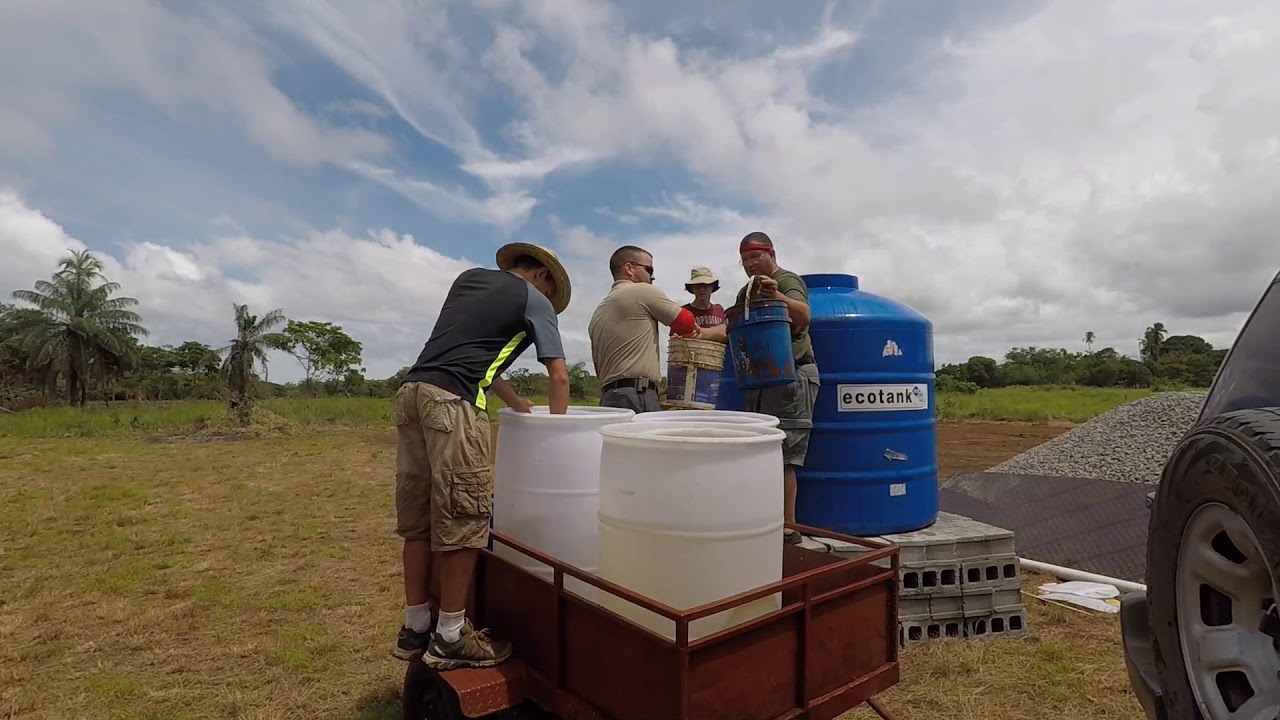 Fetching water from the river for hangar construction - YouTube