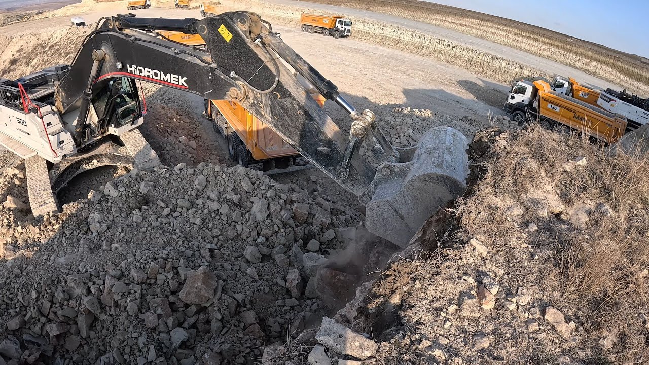 Fast and efficient operator loads trucks. - YouTube