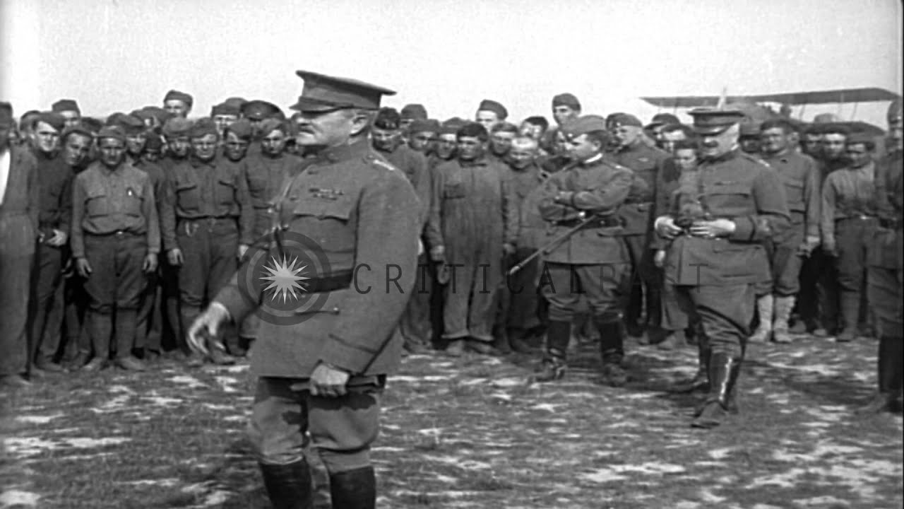General John J. Pershing speaks to pilots at an airfield and visits a ...