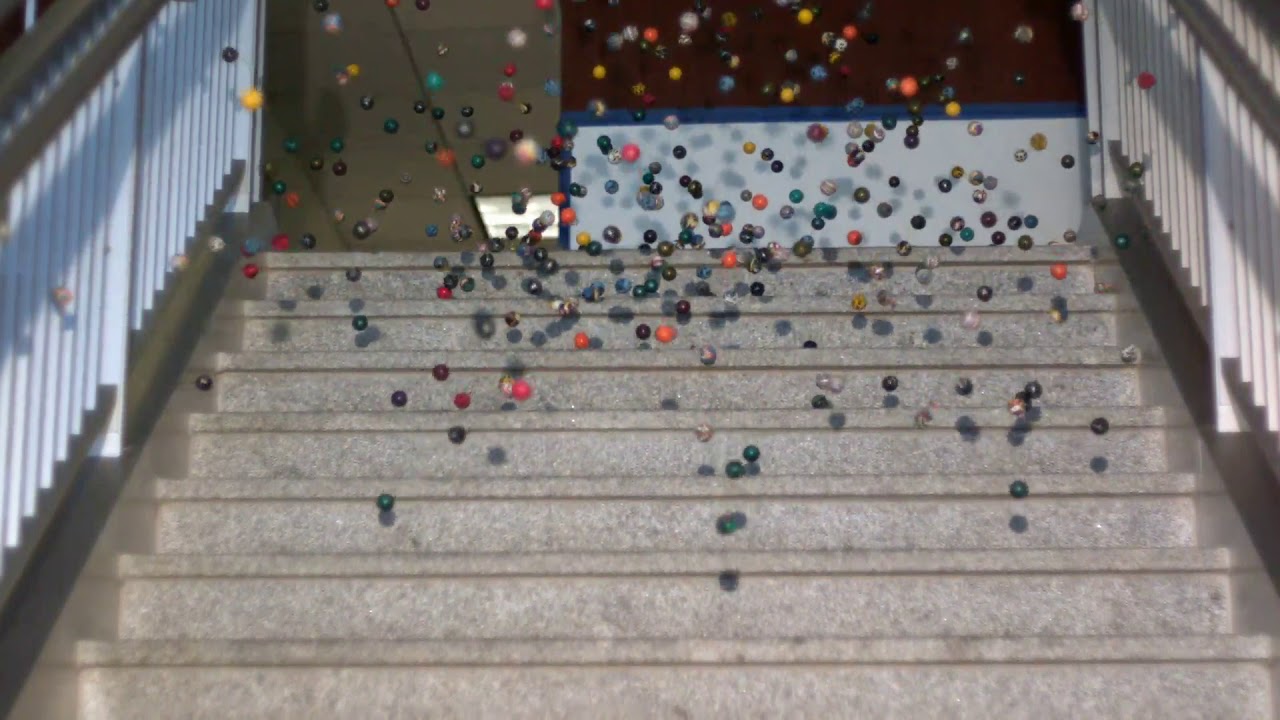 Slow motion bouncy balls swarming down stairs - YouTube