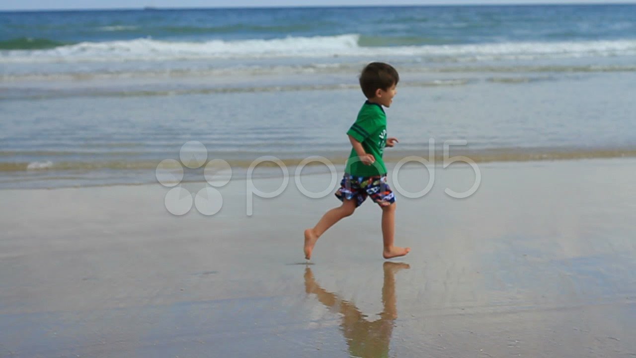 Happy Child Running On Beach Then Falling. Stock Footage - YouTube