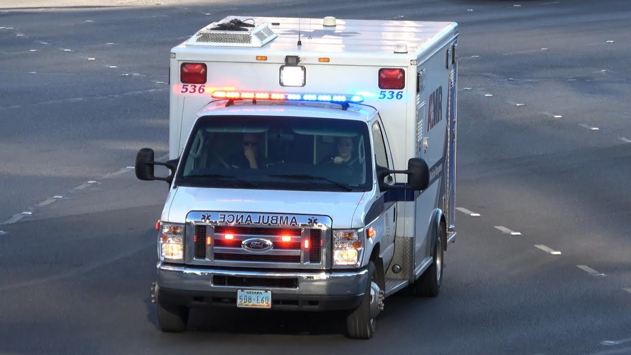 American Medical Response ambulance responding with siren and lights ...