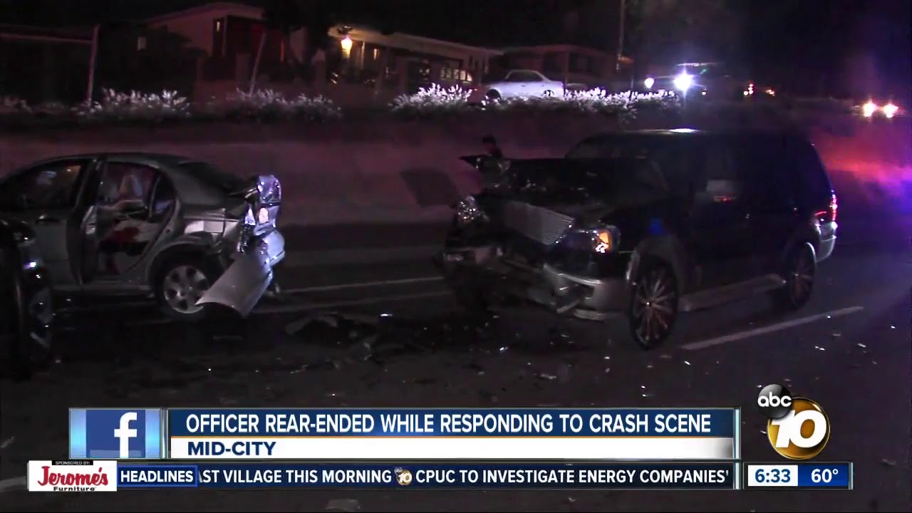 SDPD vehicle responding to crash hit by oncoming car - YouTube