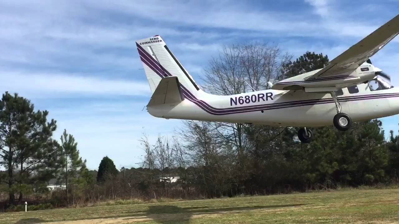 Twin Commander 680FP takeoff from grass strip - YouTube