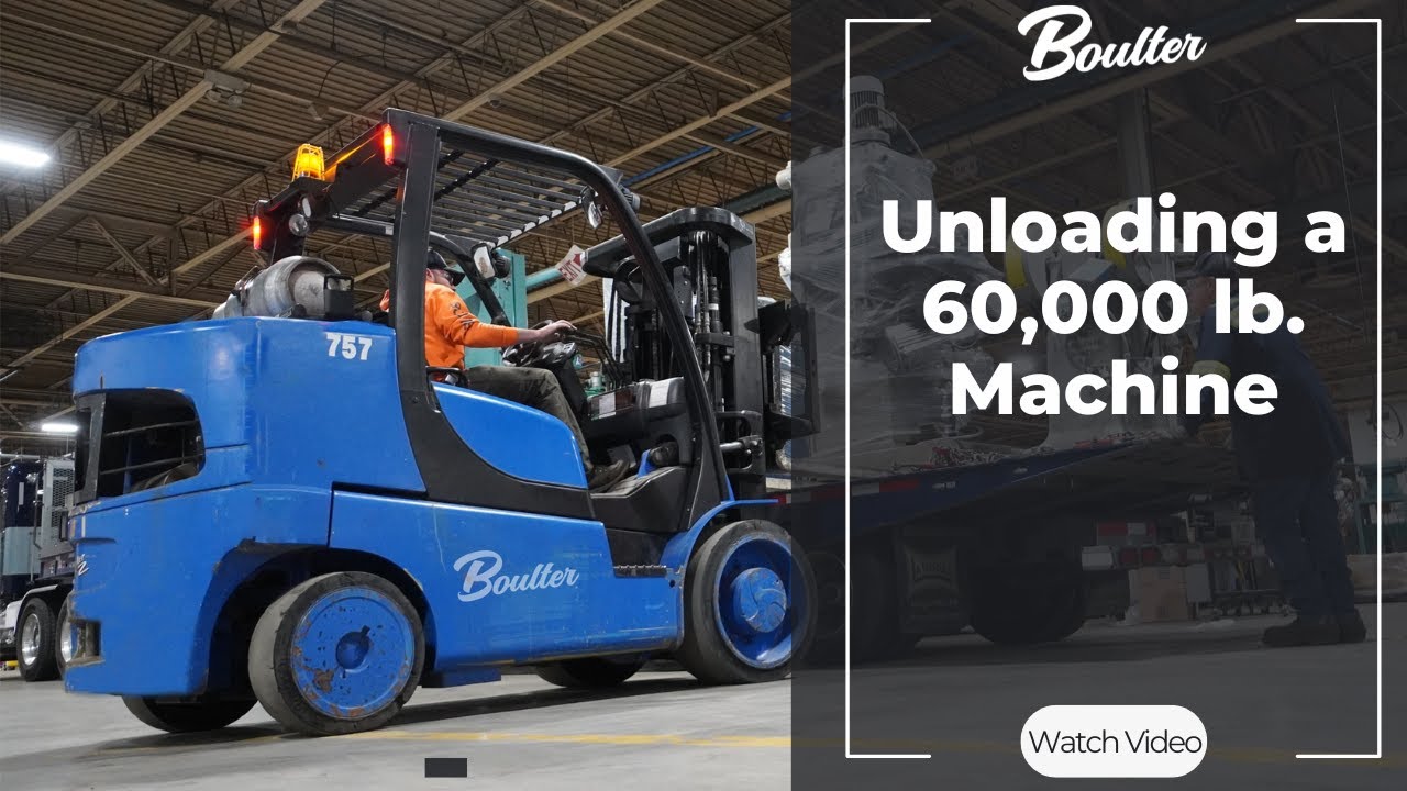 Unloading a 60,000 lb. machine - YouTube