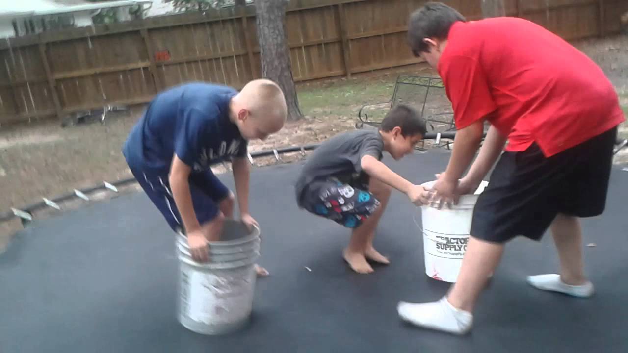 Boys bouncing in buckets - YouTube