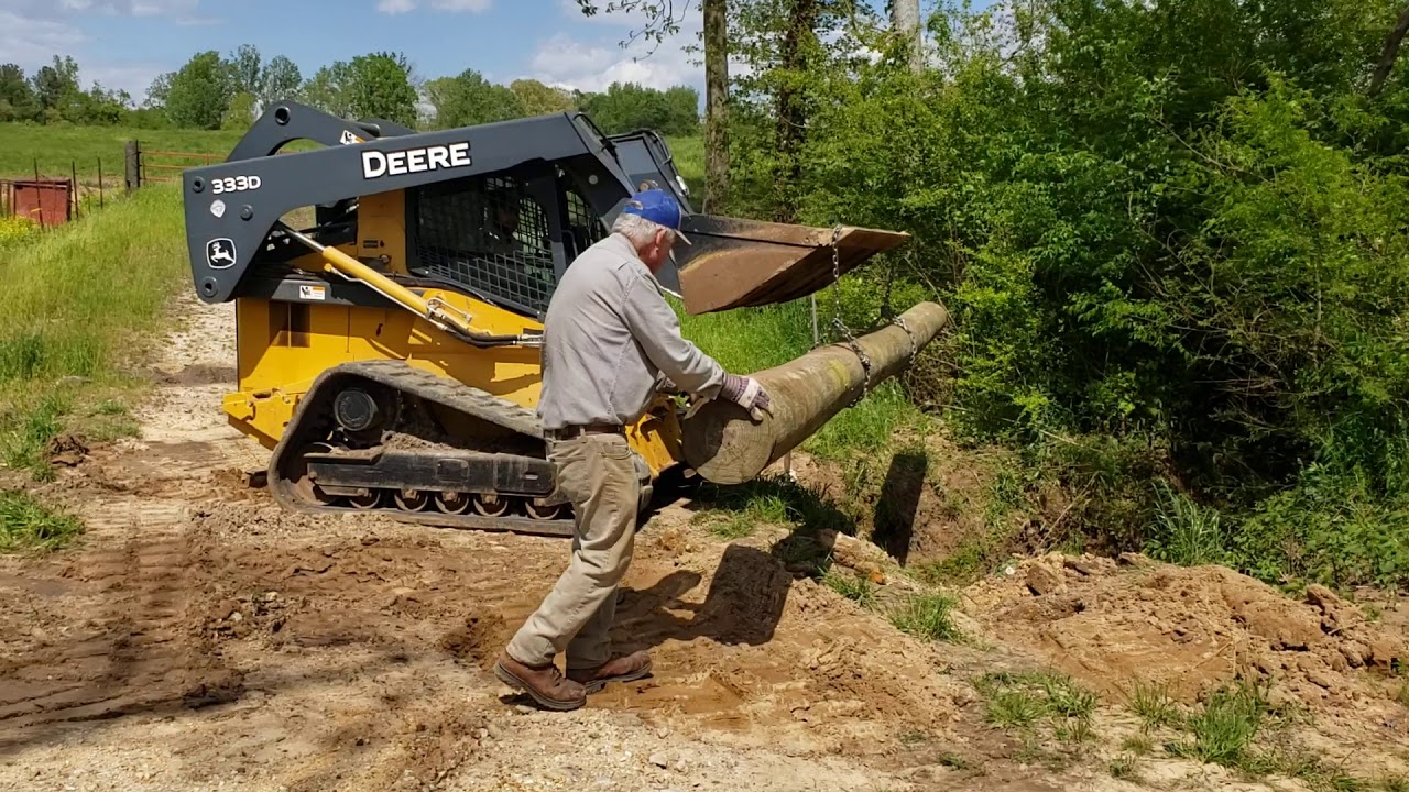 Field Road Bridge Repair: Using an old power pole to replace washed out ...