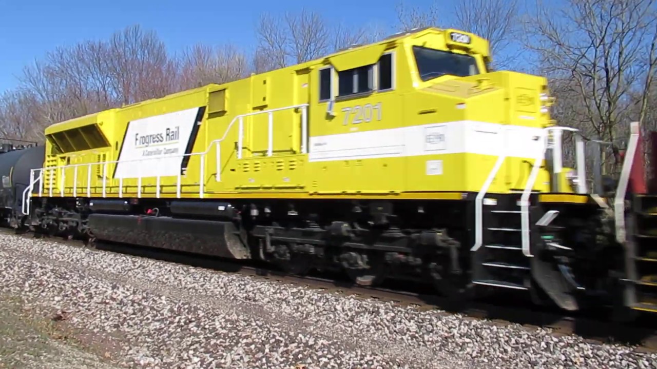 CN 2992, PRLX EMD 7201 pulling a mixed freight car train with an ...