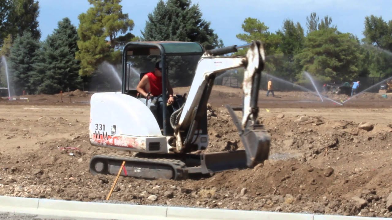 Bobcat mini excavator digging a trench - YouTube