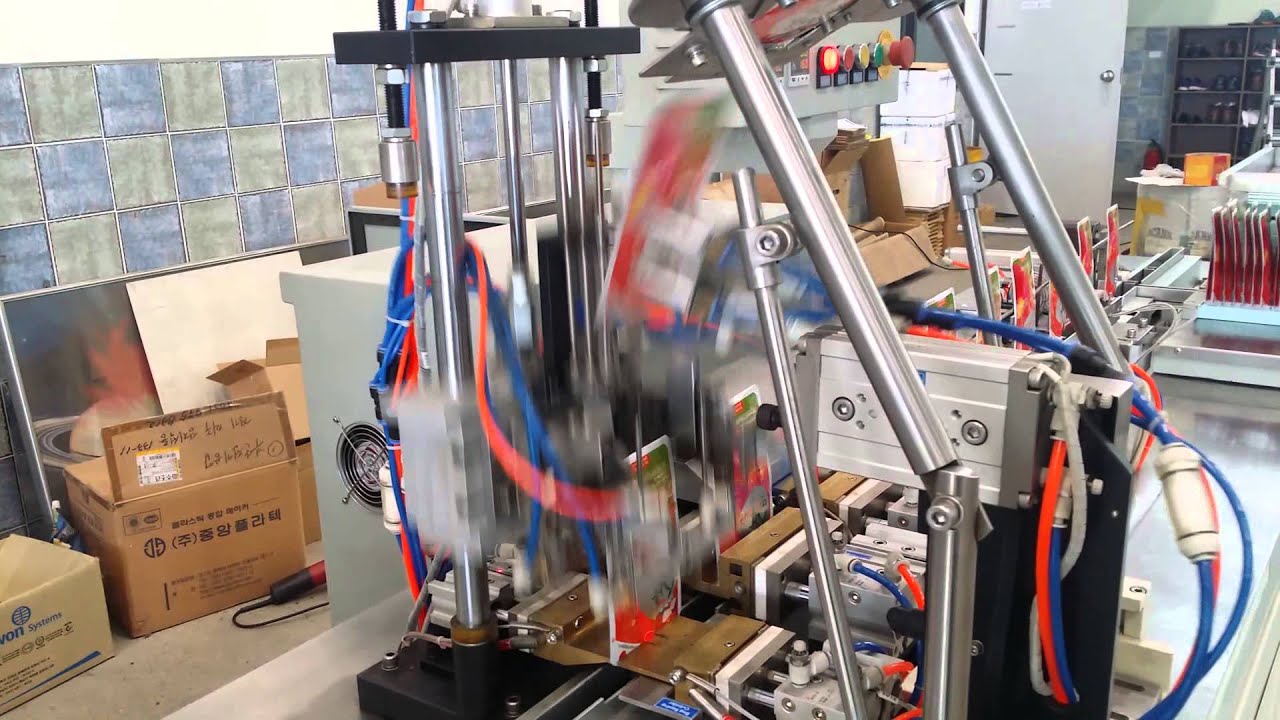 Spout inserter & sealing machine - YouTube