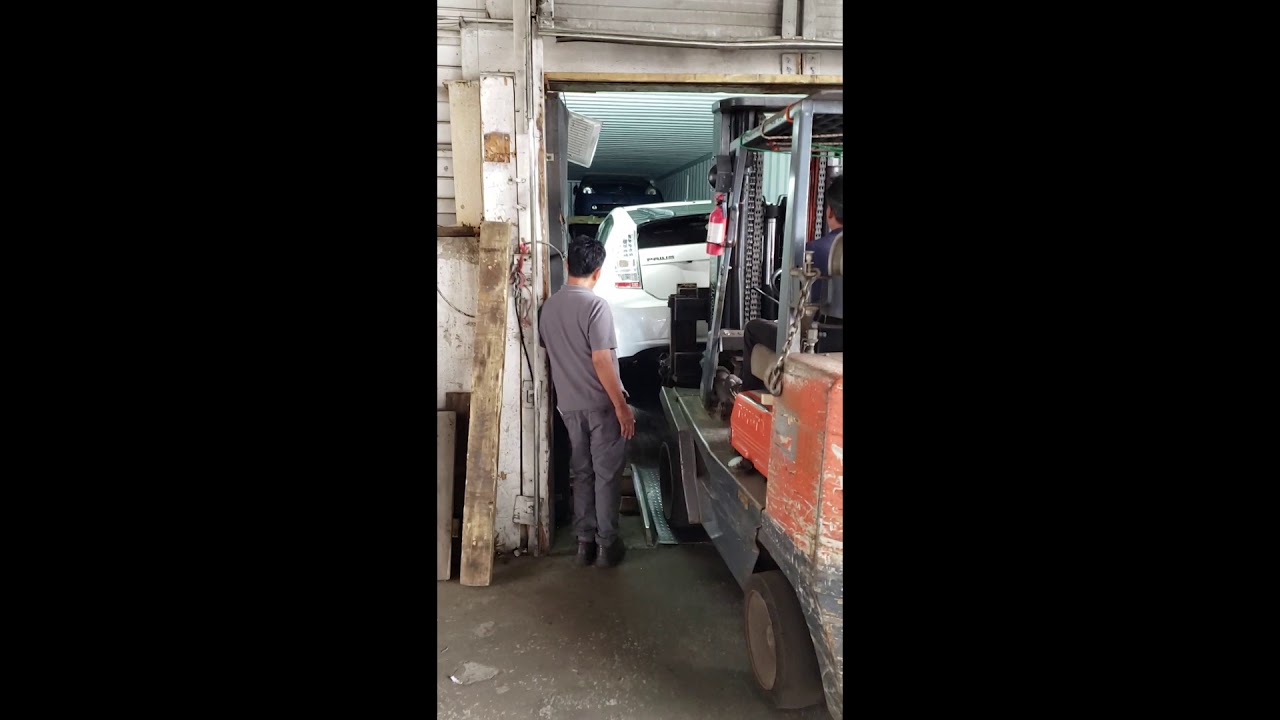 How to load a car into the container - YouTube