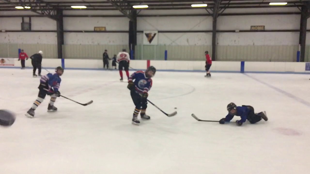 Shooting pucks at glass2 - YouTube
