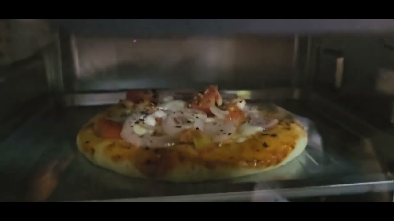 Baking pizza in otg oven@bakerychefs - YouTube