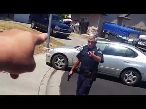Police Review Footage Of Officer Pulling Gun On Man Filming - YouTube